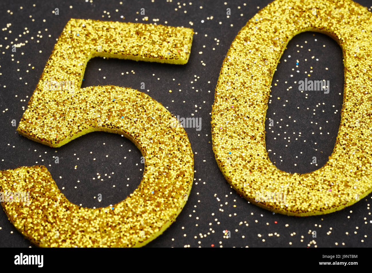 Number fifty golden color over a black background. Anniversary ...