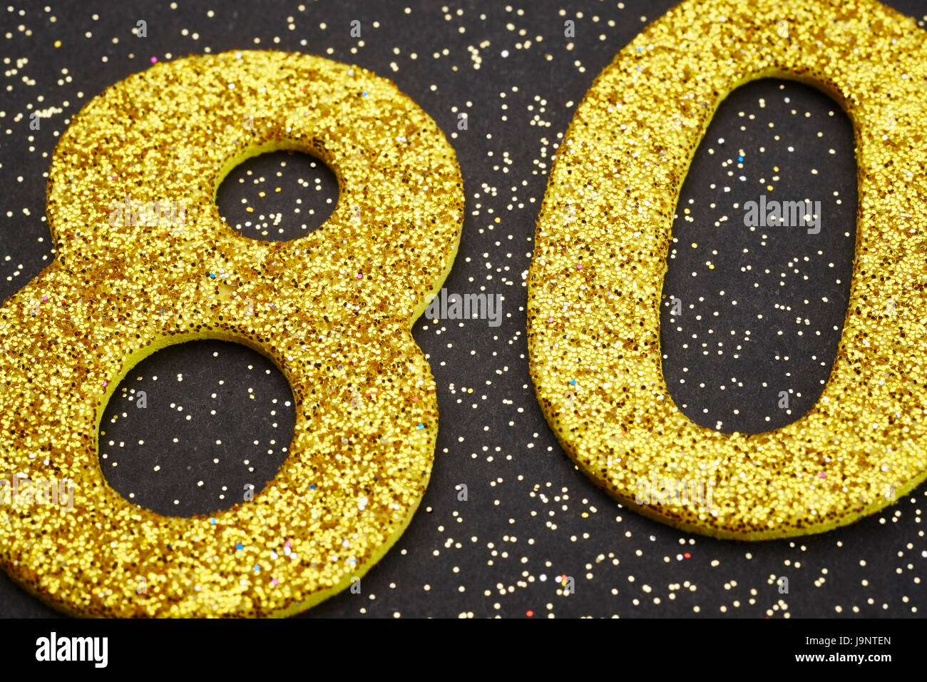 Number eighty golden color over a black background. Anniversary ...