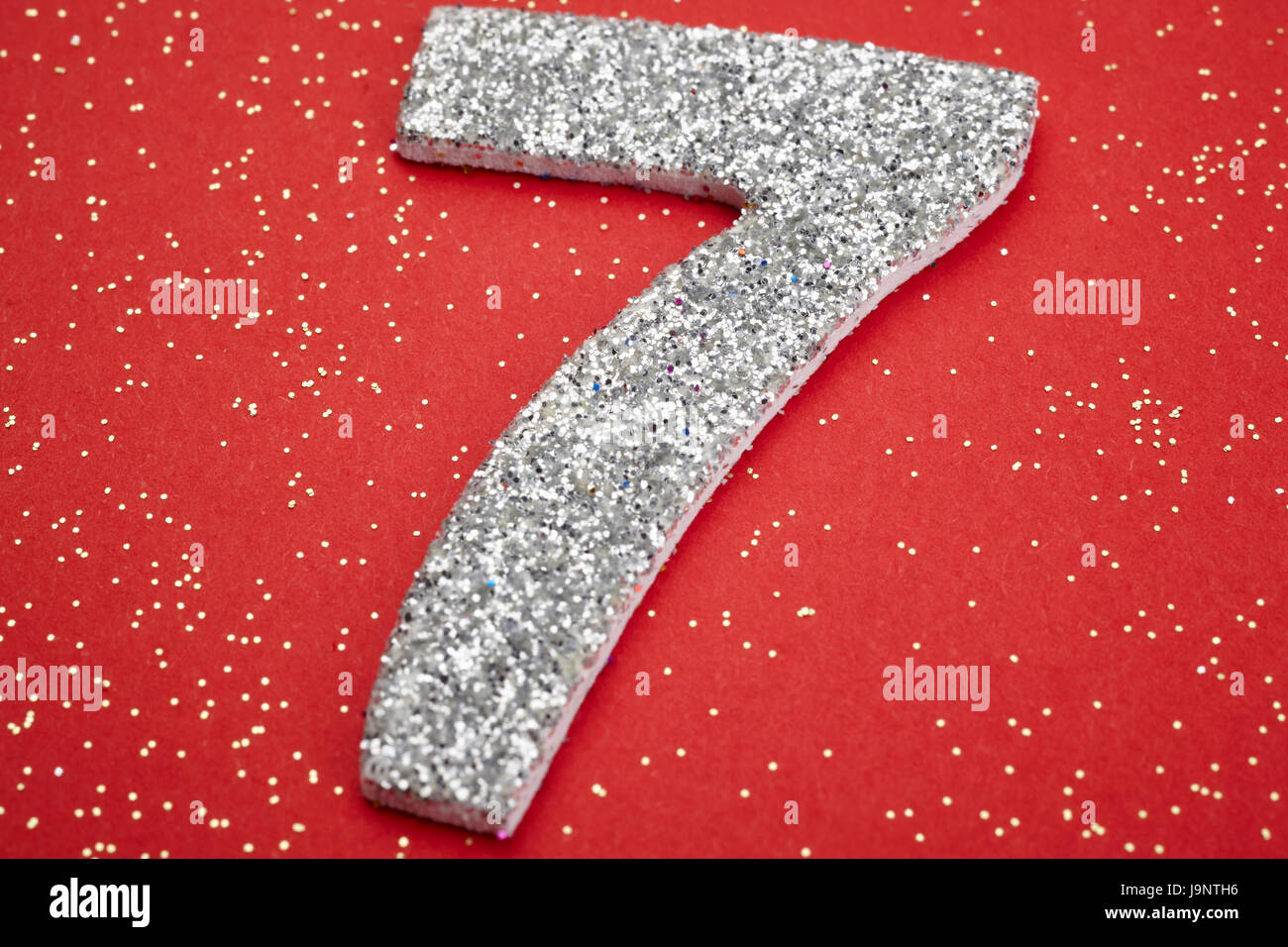 Number seven silver color over a red background. Anniversary ...