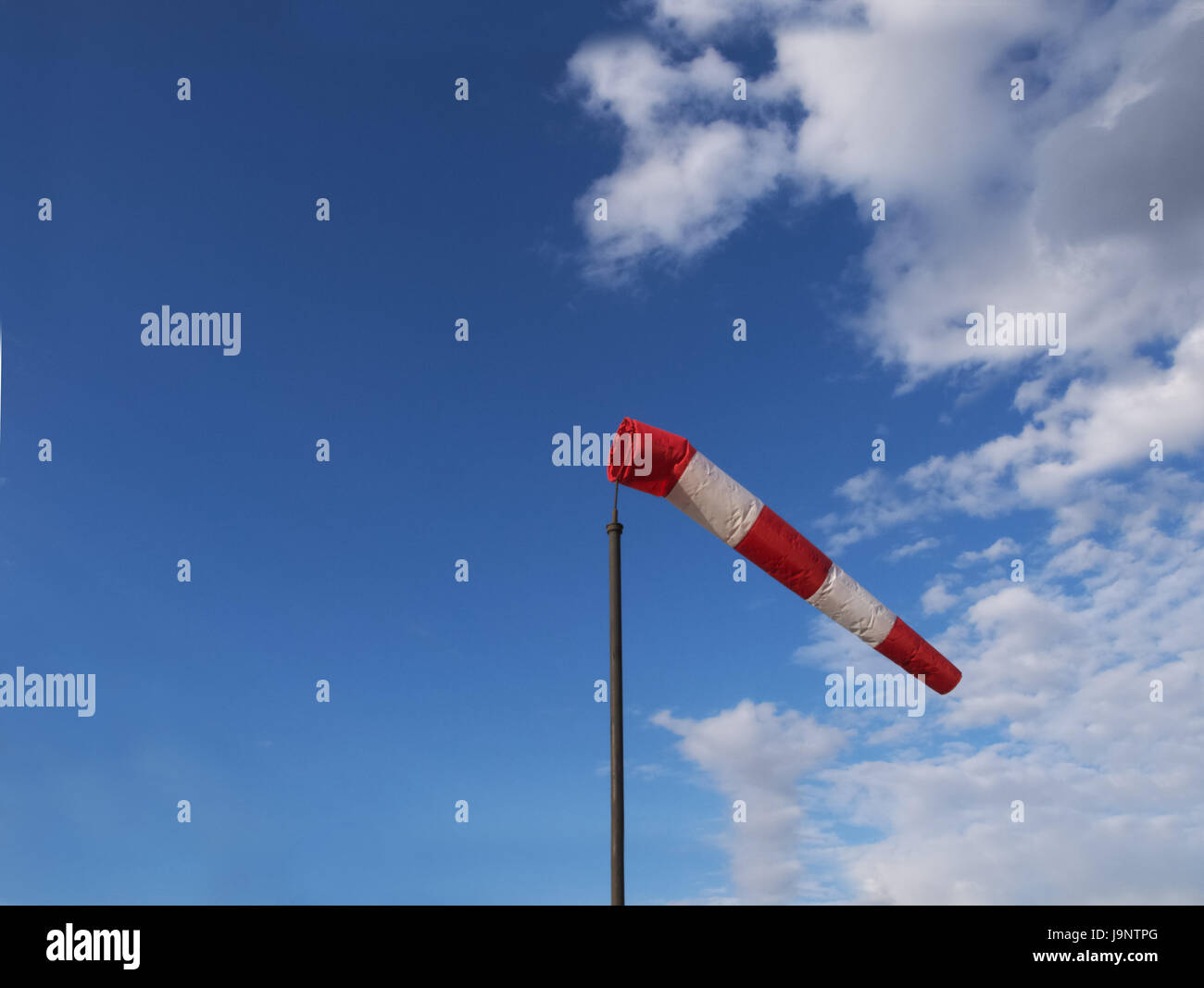 Wind cone on a background of clouds half of the sky Stock Photo - Alamy