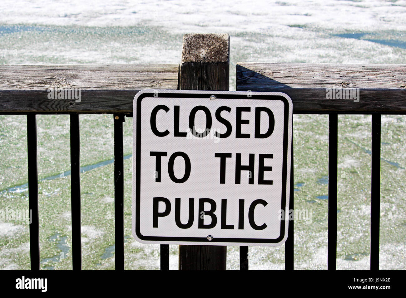 Closed to the public sign posted on a water boardwalk Stock Photo - Alamy