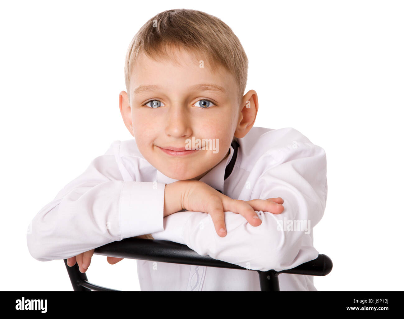 Happy seven years boy staring at you isolated Stock Photo - Alamy