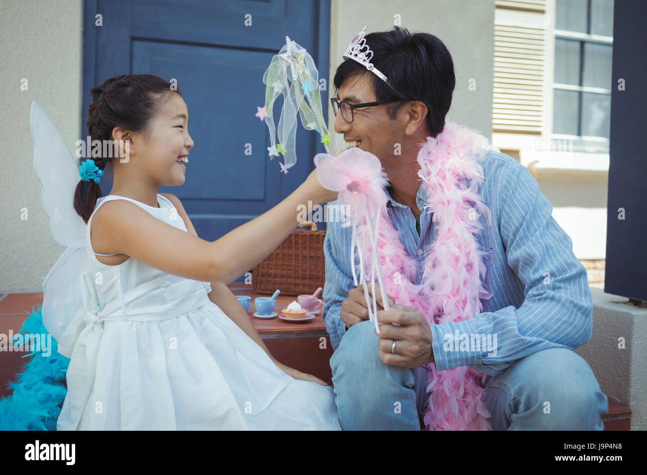 Father and daughter in fairy costume at home Stock Photo - Alamy