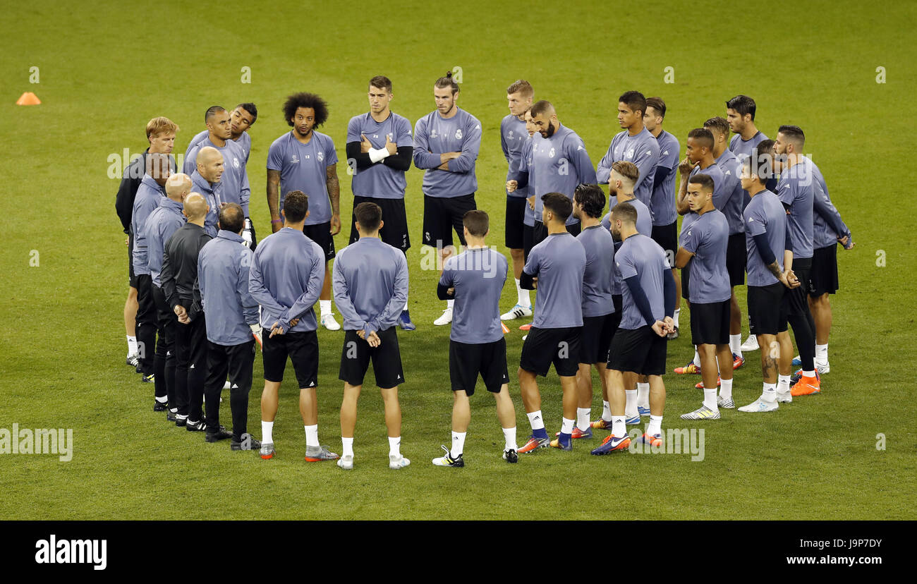 The Real Madrid team huddle with Gareth Bale (top) during a training ...