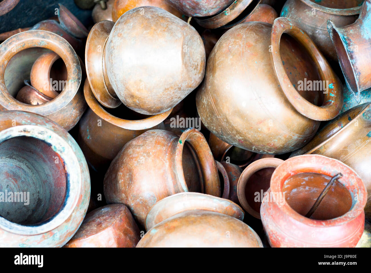 Old and rusted Copper/Brass vessels/pots as background as a texture ...