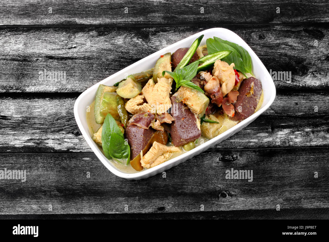 Thai popular recipe, Green chicken curry in coconut milk with long ...