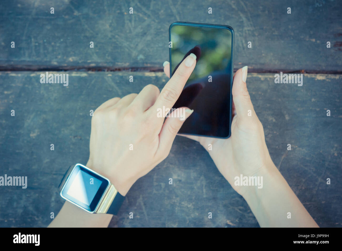 Top down viewpoint close up shoot of female hand holding mobile phone ...