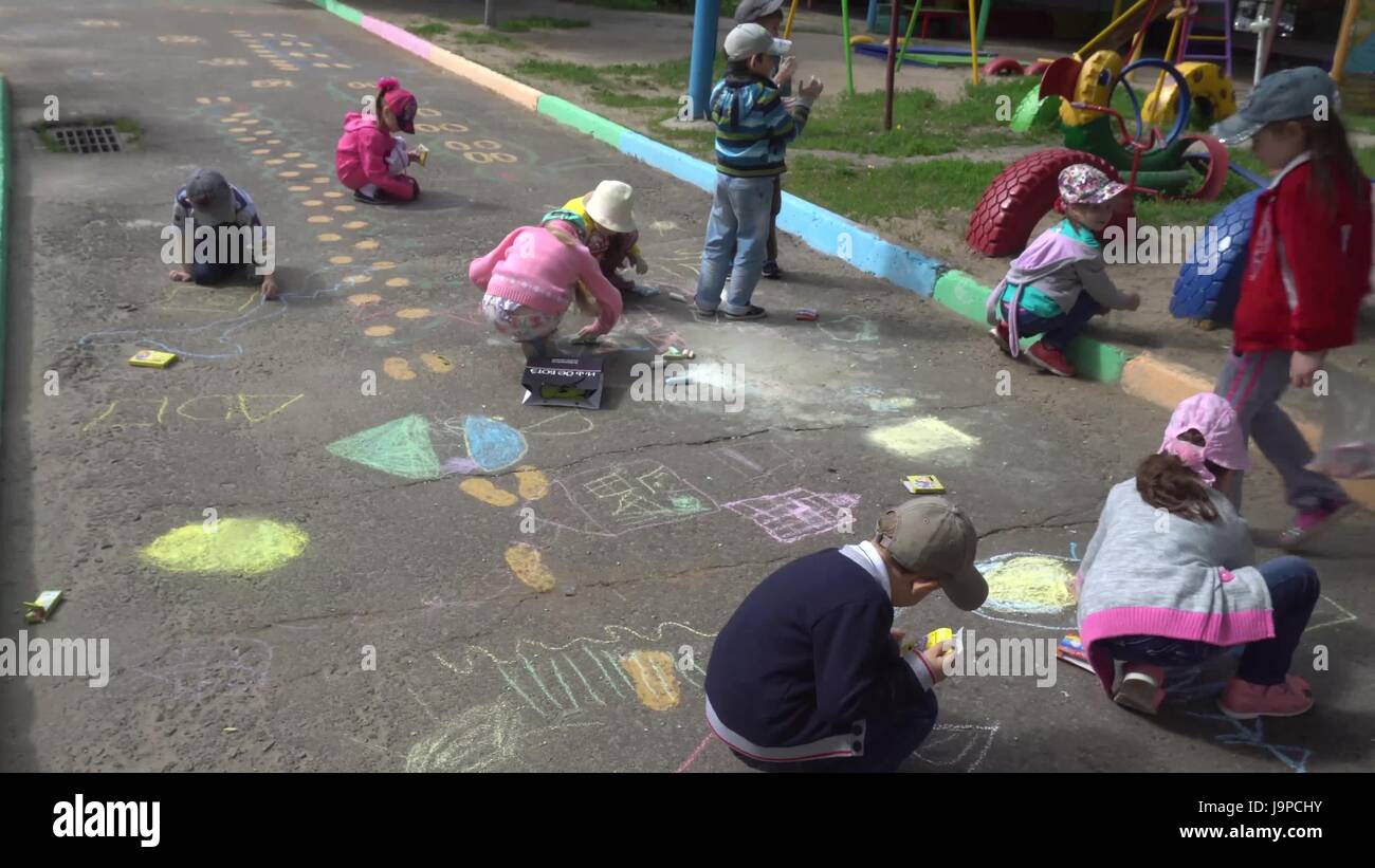 Kursk, Russia - June 1, 2017:children draw with crayons on the pavement ...