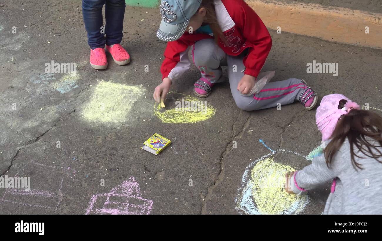 Kursk, Russia - June 1, 2017:children draw with crayons on the pavement ...