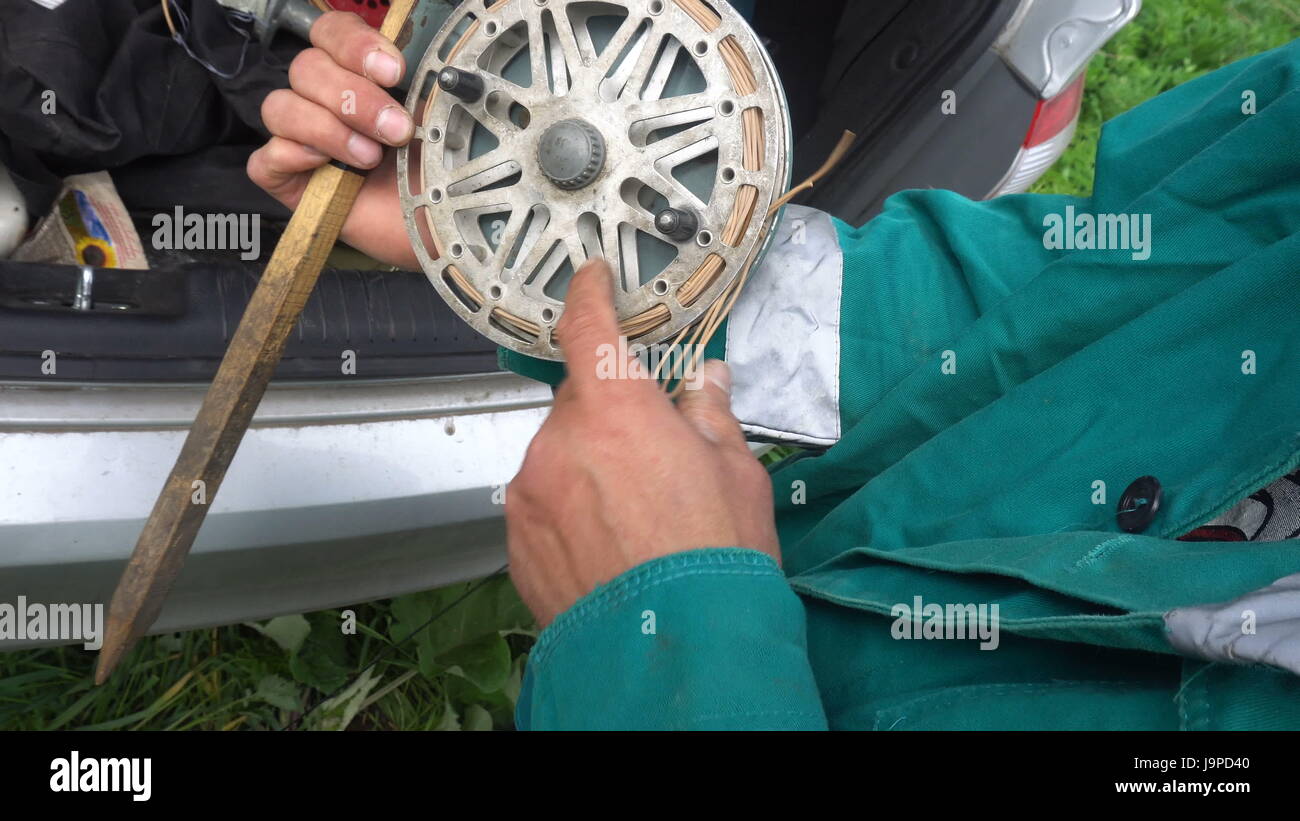 Fisherman shows device catching hi-res stock photography and images - Alamy