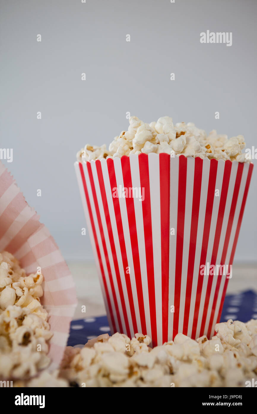 Scattered popcorn against white background with 4th july theme Stock ...