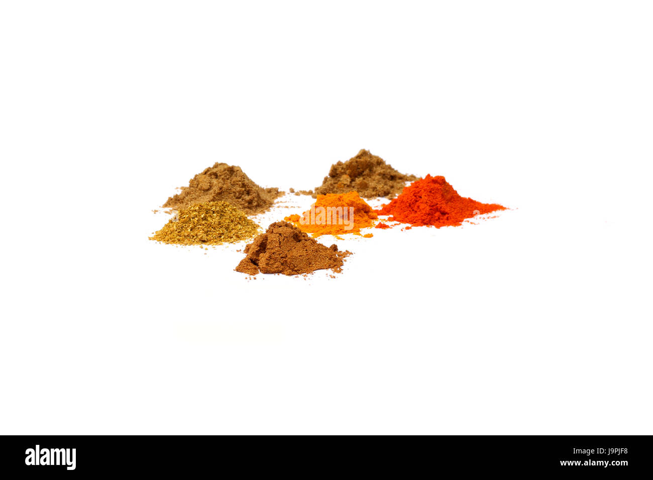 Ground spices on white background Stock Photo - Alamy