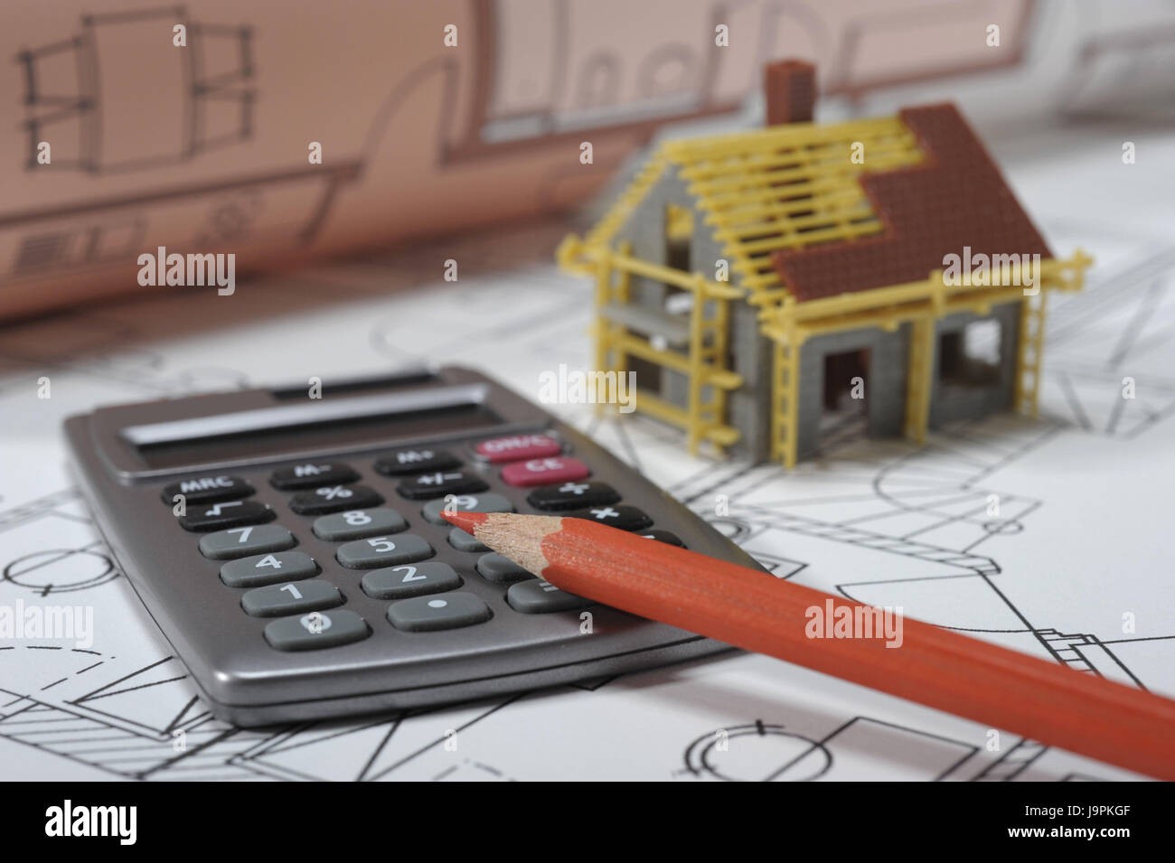 Architecture,architect's plan,model house,electronic calculator,red pen ...