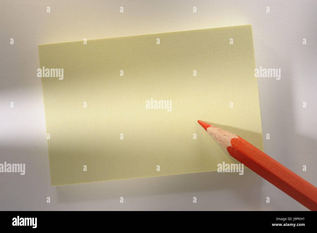 Note slip of paper with pen Stock Photo - Alamy