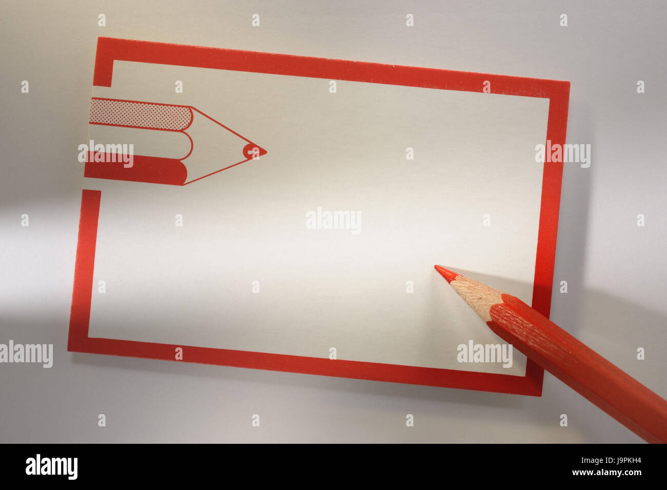 Note slip of paper with pen Stock Photo - Alamy