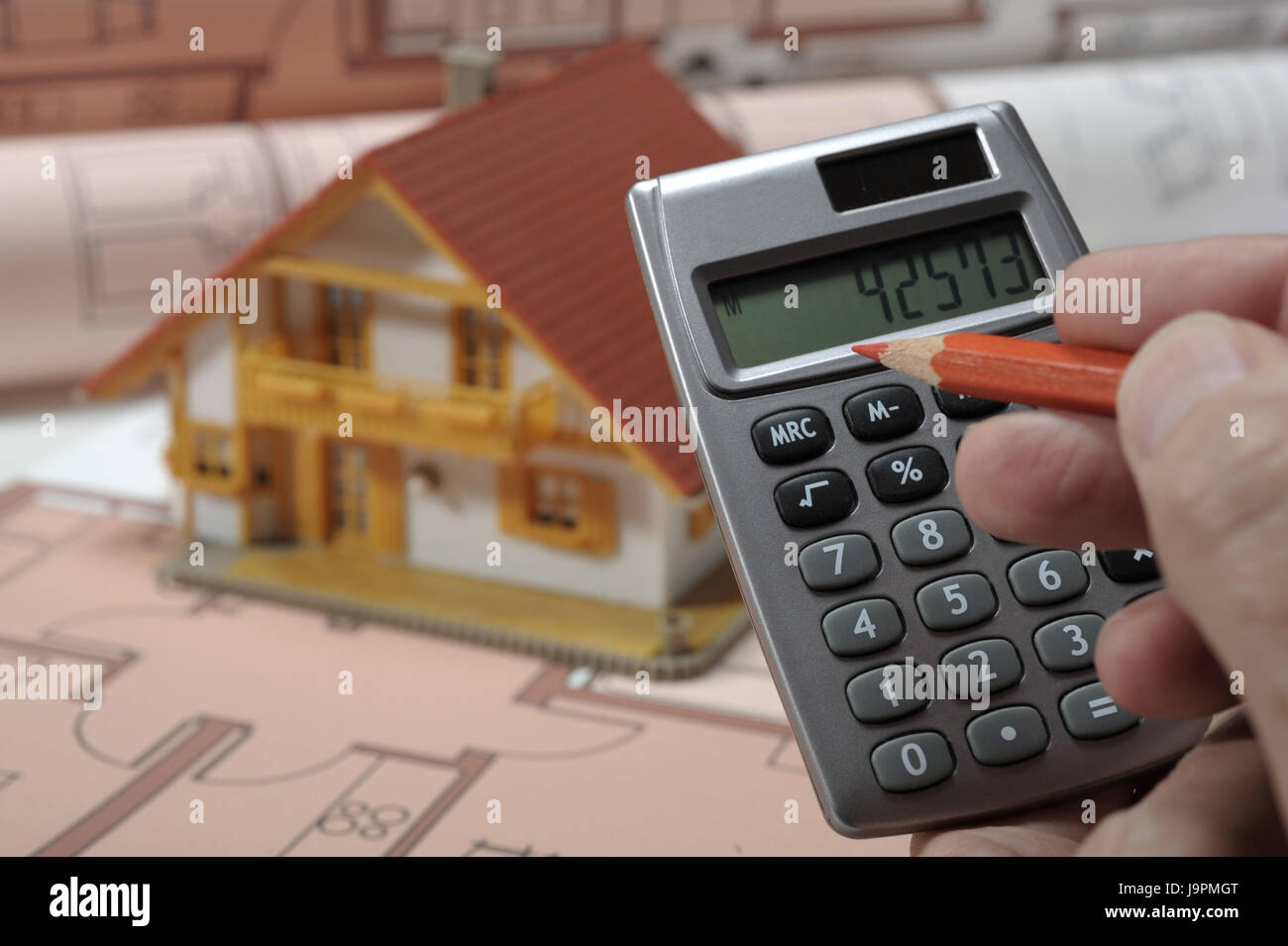 Architecture,architect's plan,model house,electronic calculator,red pen ...