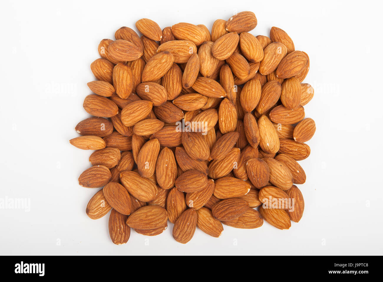 Many almonds isolated on white background Stock Photo - Alamy