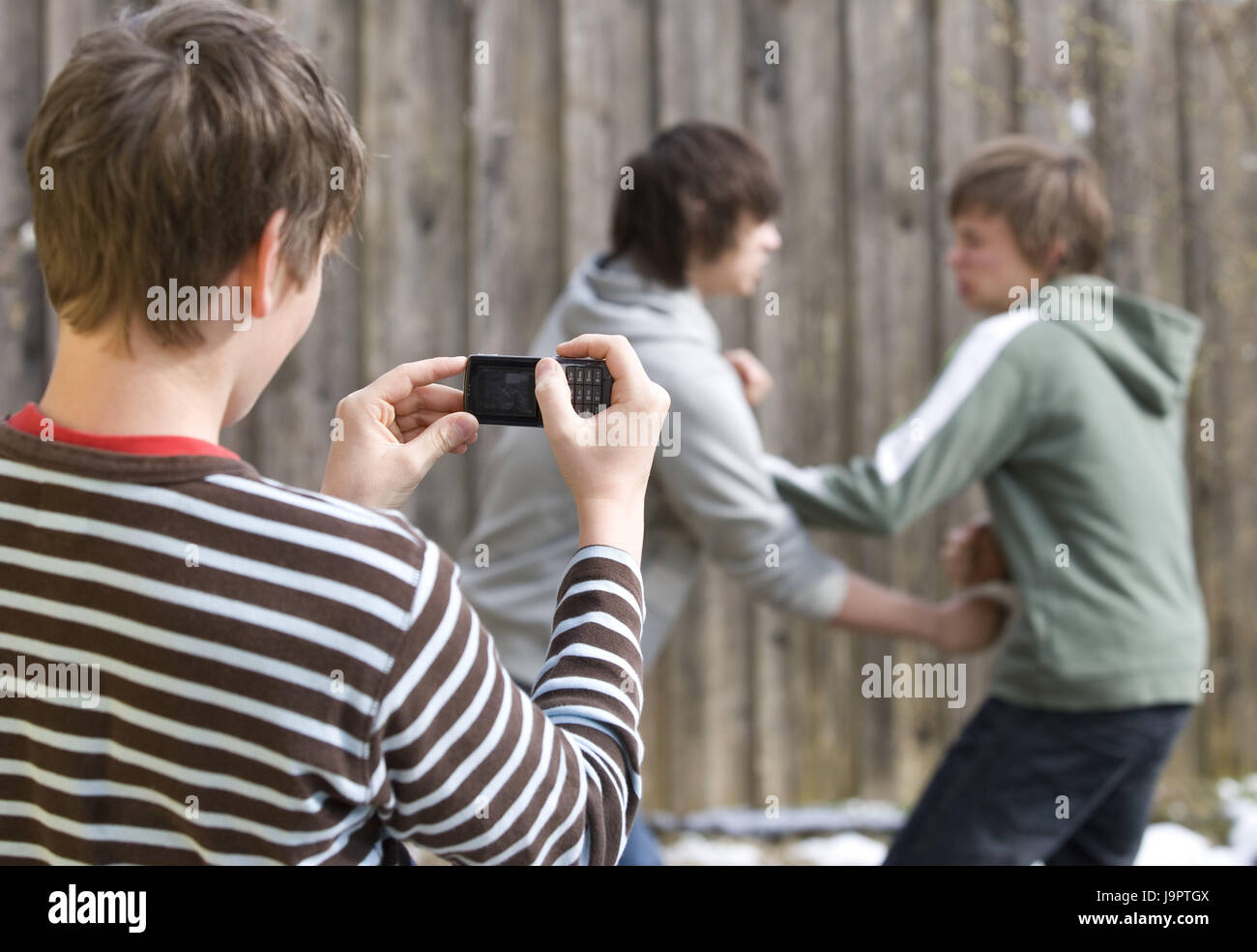 Young persons,aggression,fight,mobile phone,film,blur,boy,teenager ...