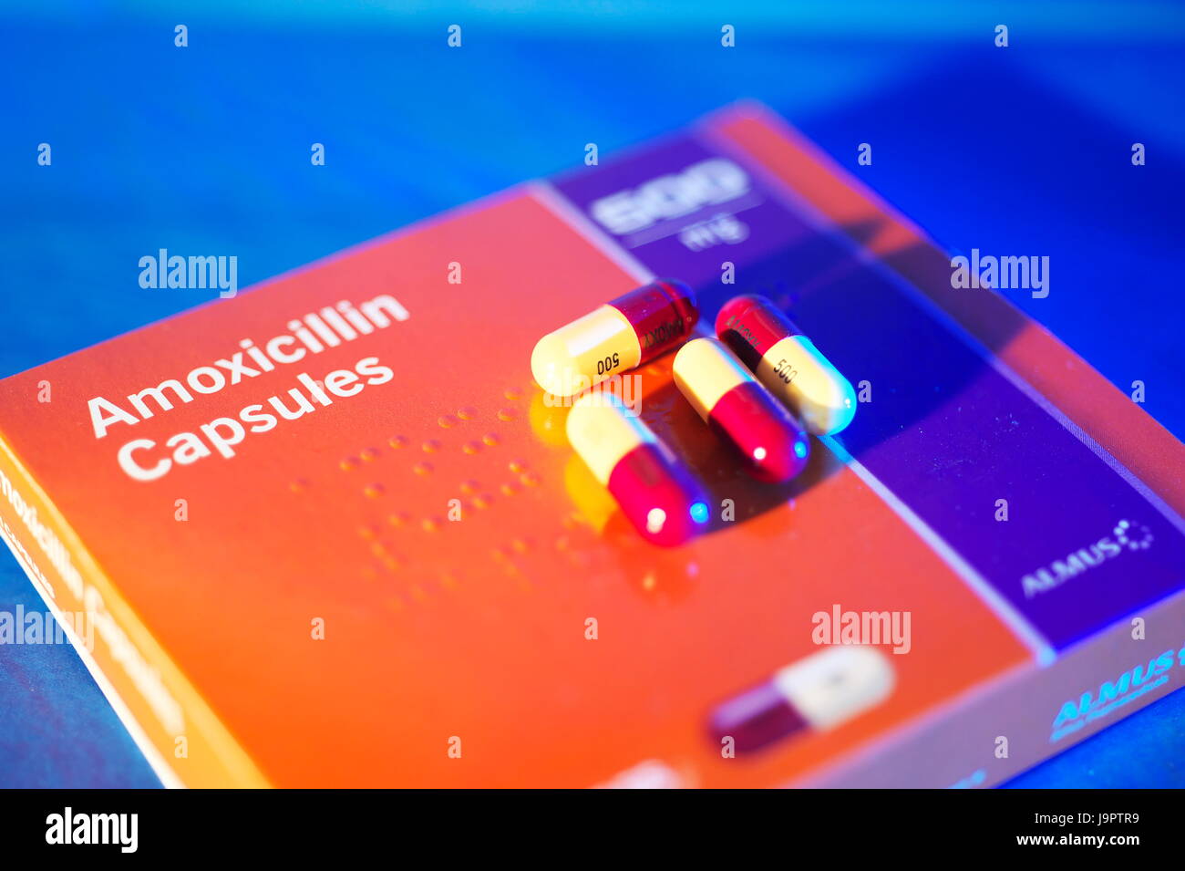 Still life dramatic lighting of Amoxicillin tablets in and out of ...