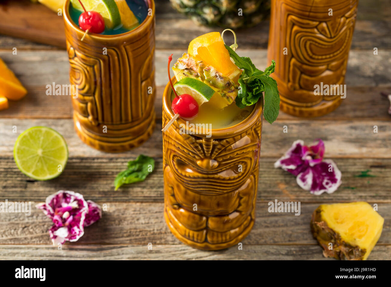 Refreshing Cold Tiki Drink Cocktails with Pineapple Cherry Orange ...