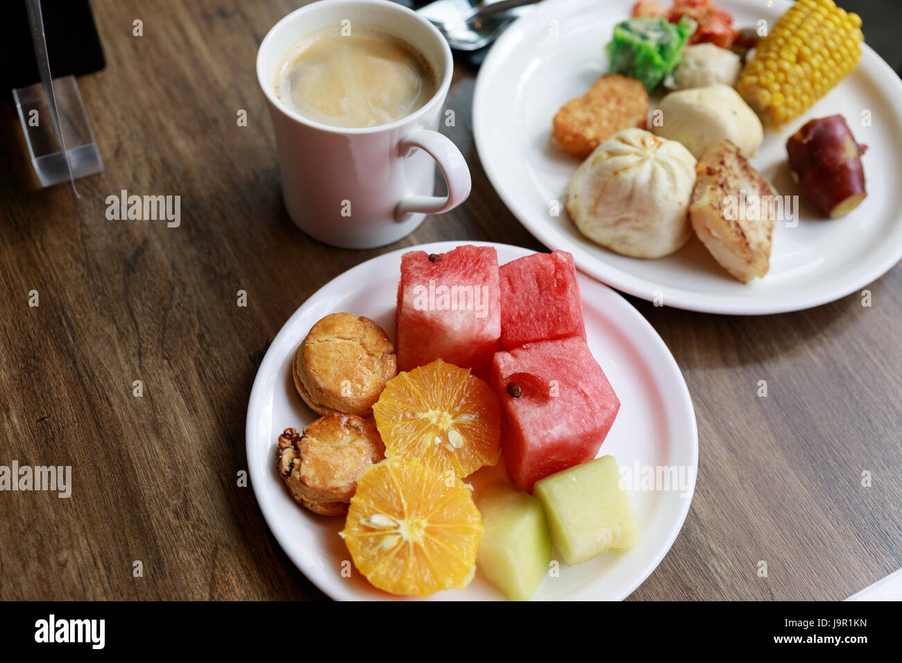 Dish of mixed breakfast - Bread, fruits, coffee Stock Photo - Alamy