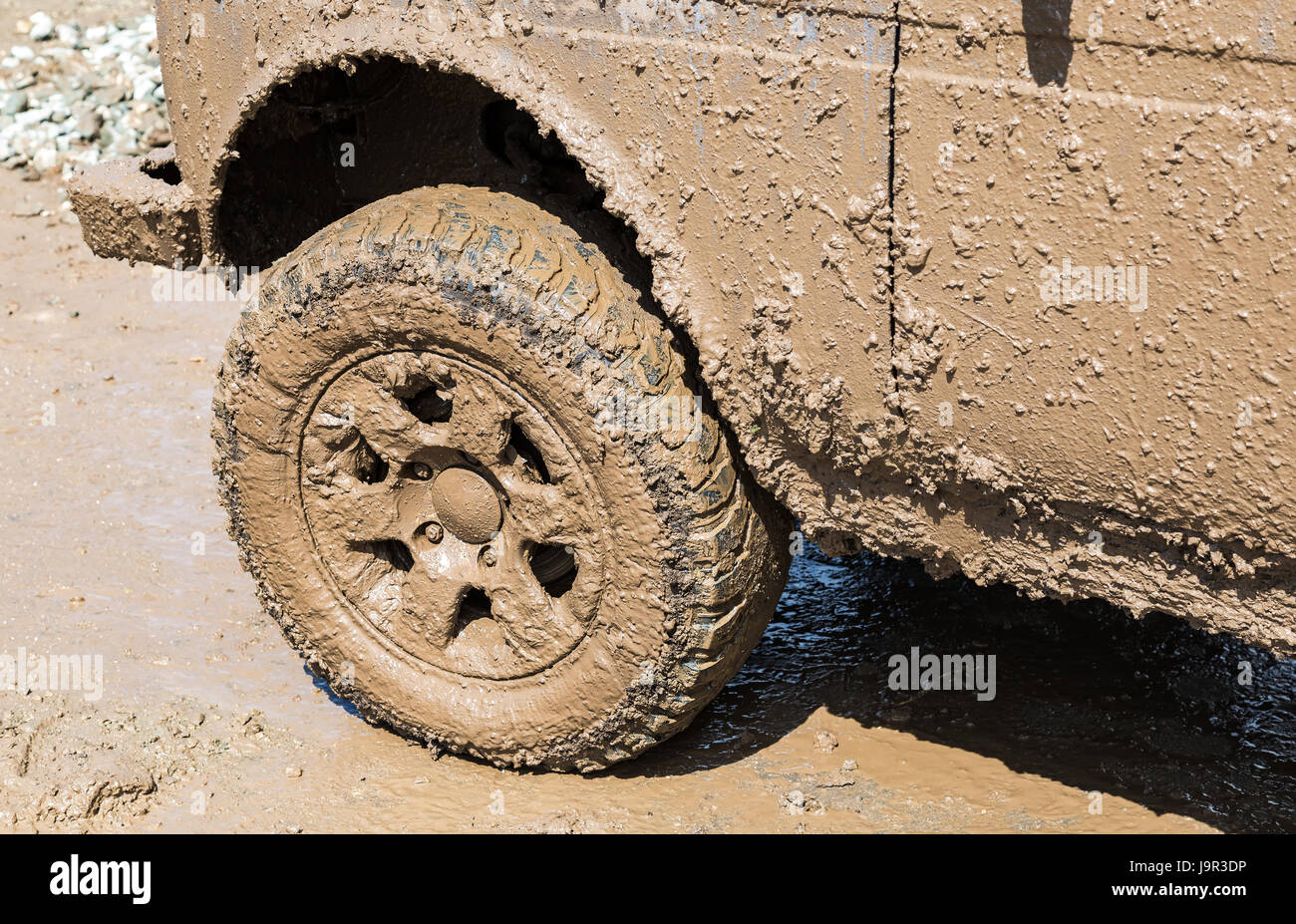 Dirty wheel of an off-road car after driving in the rain Stock Photo ...