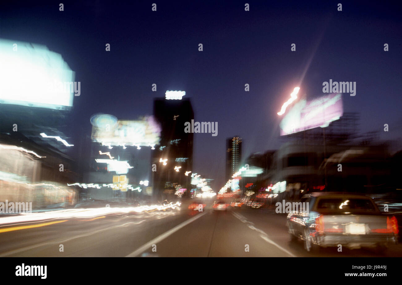The Sunset Strip seen from a car driving along at night in Los Angeles ...
