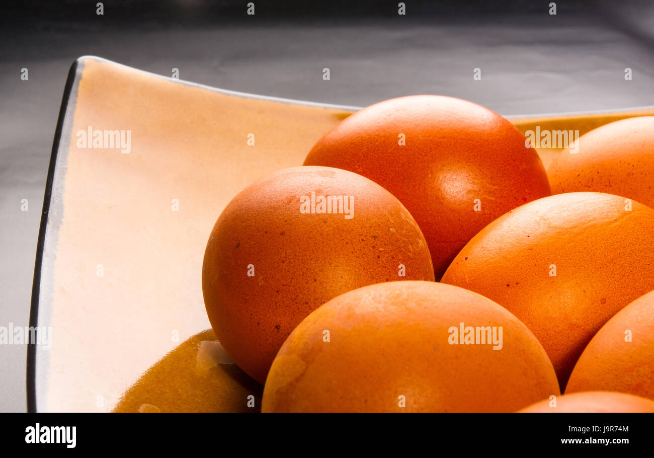 eggs colored with natural dye on brown dish Stock Photo - Alamy
