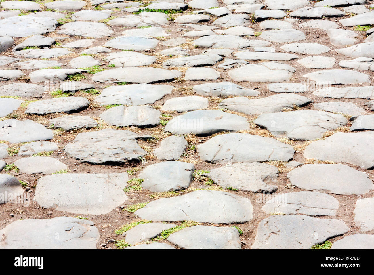 Roman empire cobblestone street in Ostia Antica - Rome - Italy Stock ...