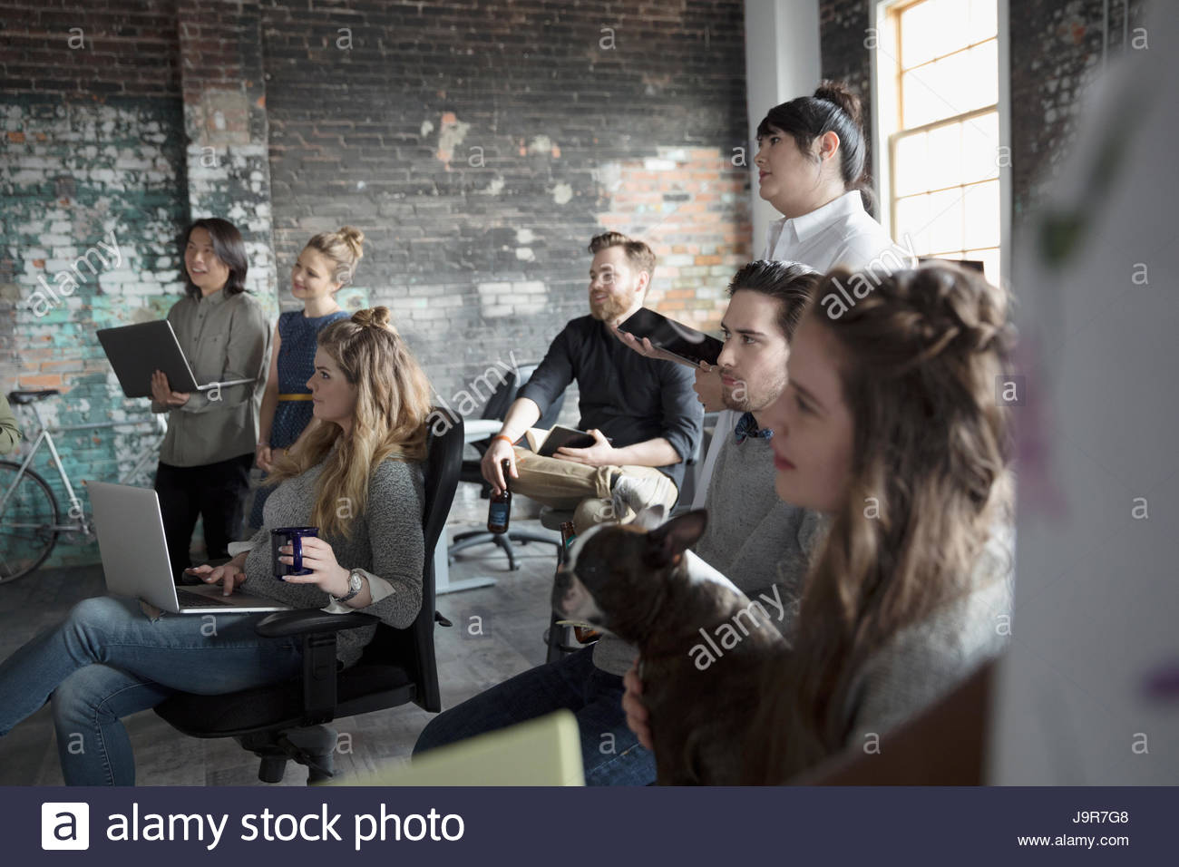 Attentive creative business people listening in meeting Stock Photo - Alamy