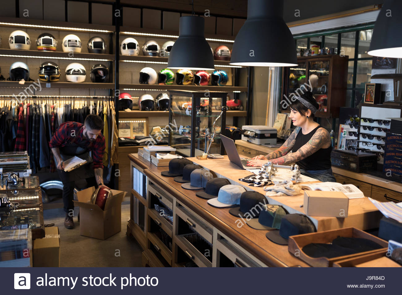 Young woman behind shop counter hi-res stock photography and images - Alamy