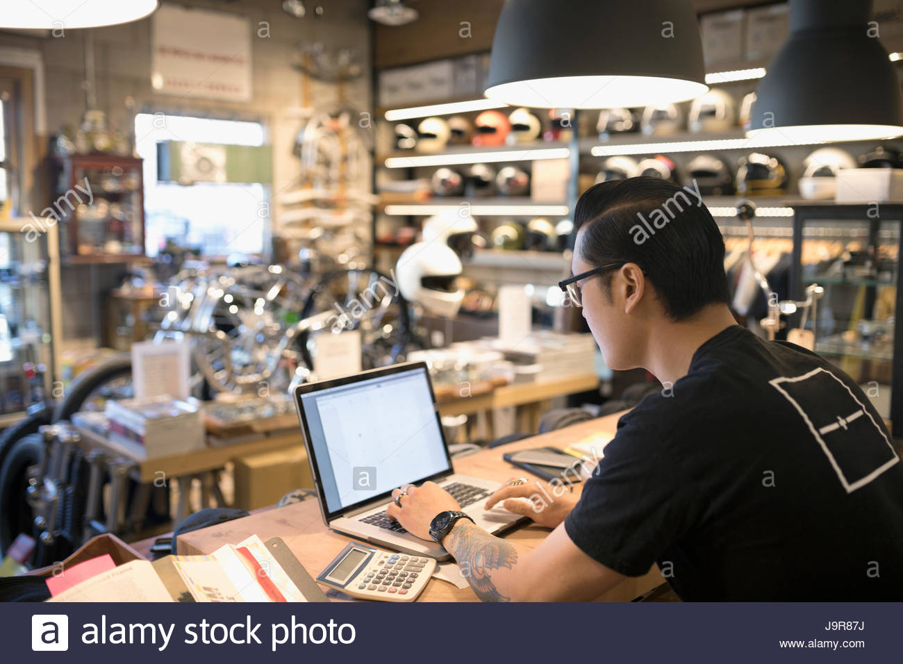Man black hair on a motorcycle hi-res stock photography and images - Alamy