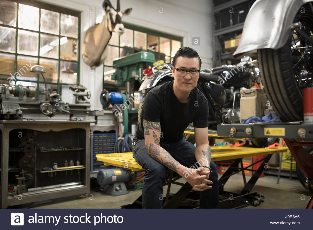 Black man repair shop worker hi-res stock photography and images - Alamy