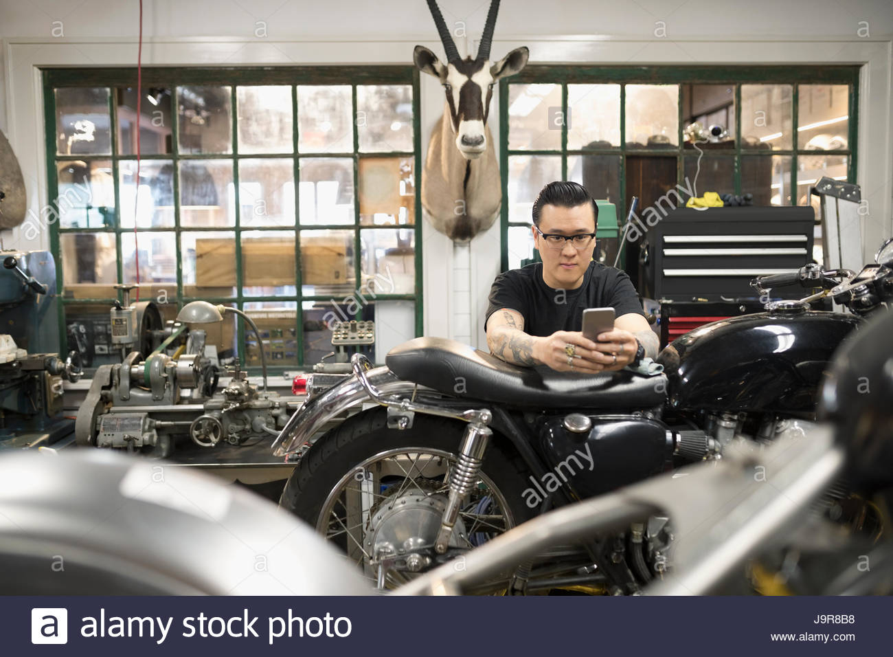 Black man repair shop worker hi-res stock photography and images - Alamy