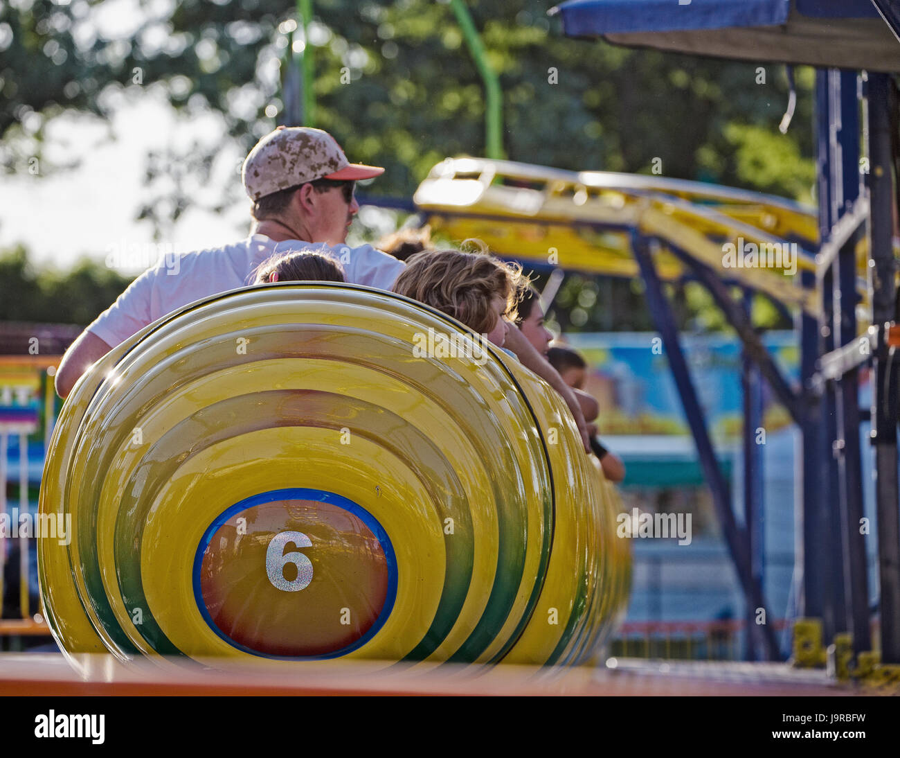 A family taking a ride on the midway of the Shasta County Fair in ...