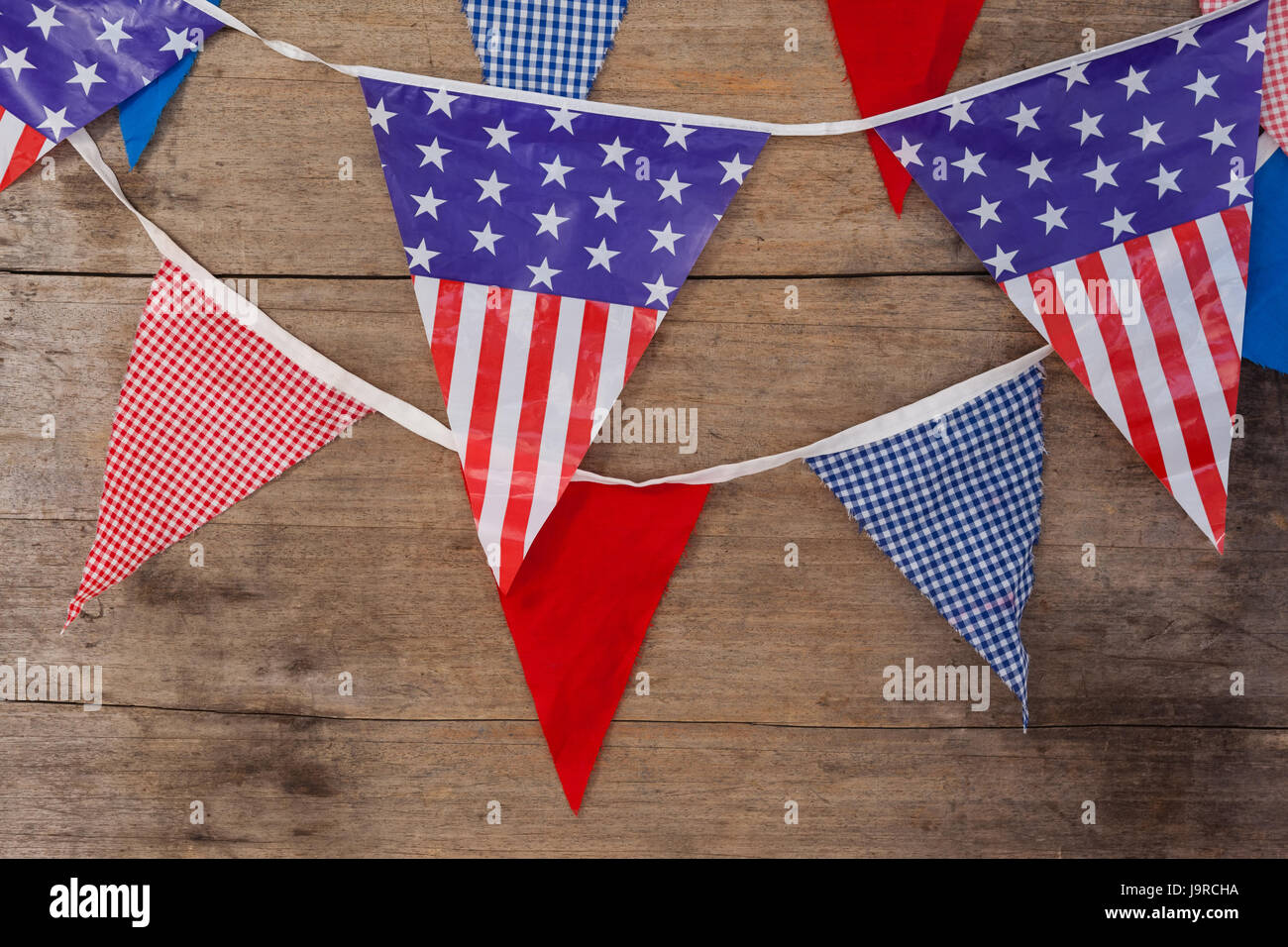 Bunting flags arranged on wooden table with 4th July theme Stock Photo ...