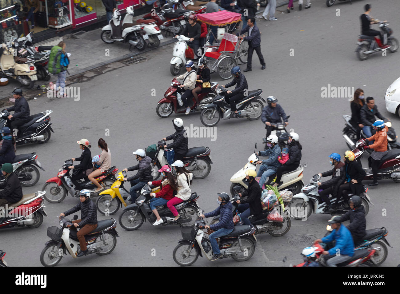 Crazy traffic at busy intersection by Hoan Kiem Lake and Old Quarter ...