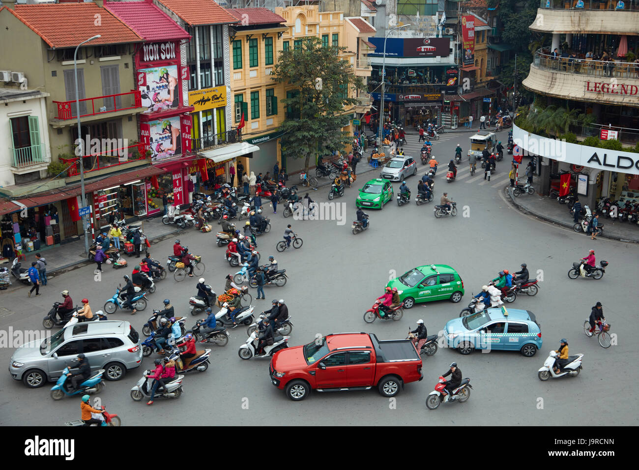 Crazy traffic at busy intersection by Hoan Kiem Lake and Old Quarter ...