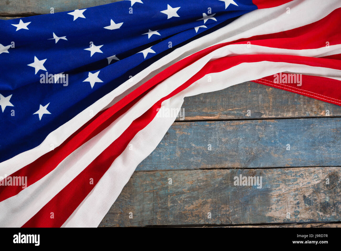Close-up of an American flag on a wooden table Stock Photo - Alamy