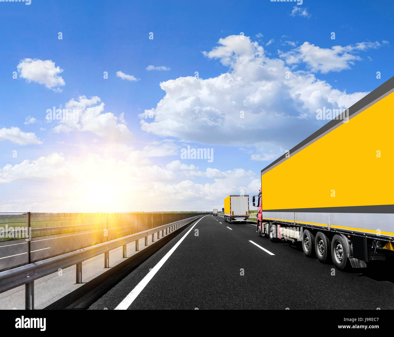Trucks on the highway Stock Photo - Alamy