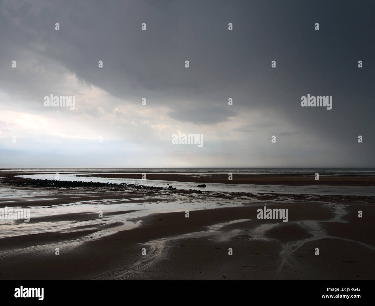 summer rain storm on a beach with dramatic clouds Stock Photo - Alamy