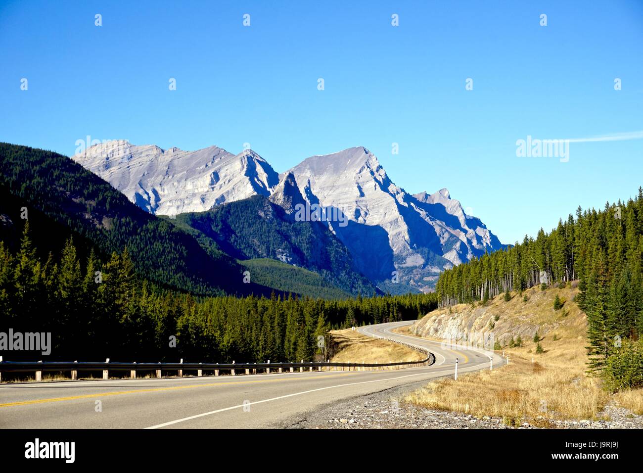 Highway through the mountains Stock Photo - Alamy