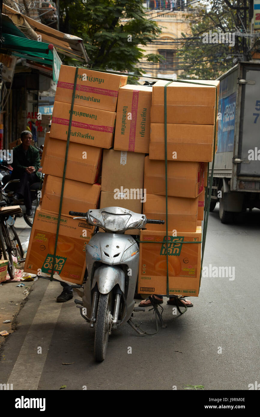 Heavily loaded scooter, Old Quarter, Hanoi, Vietnam Stock Photo - Alamy
