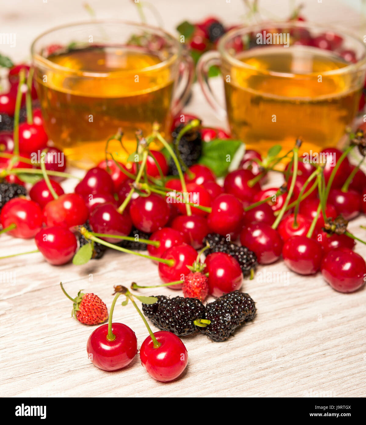 berries with green tea Stock Photo - Alamy