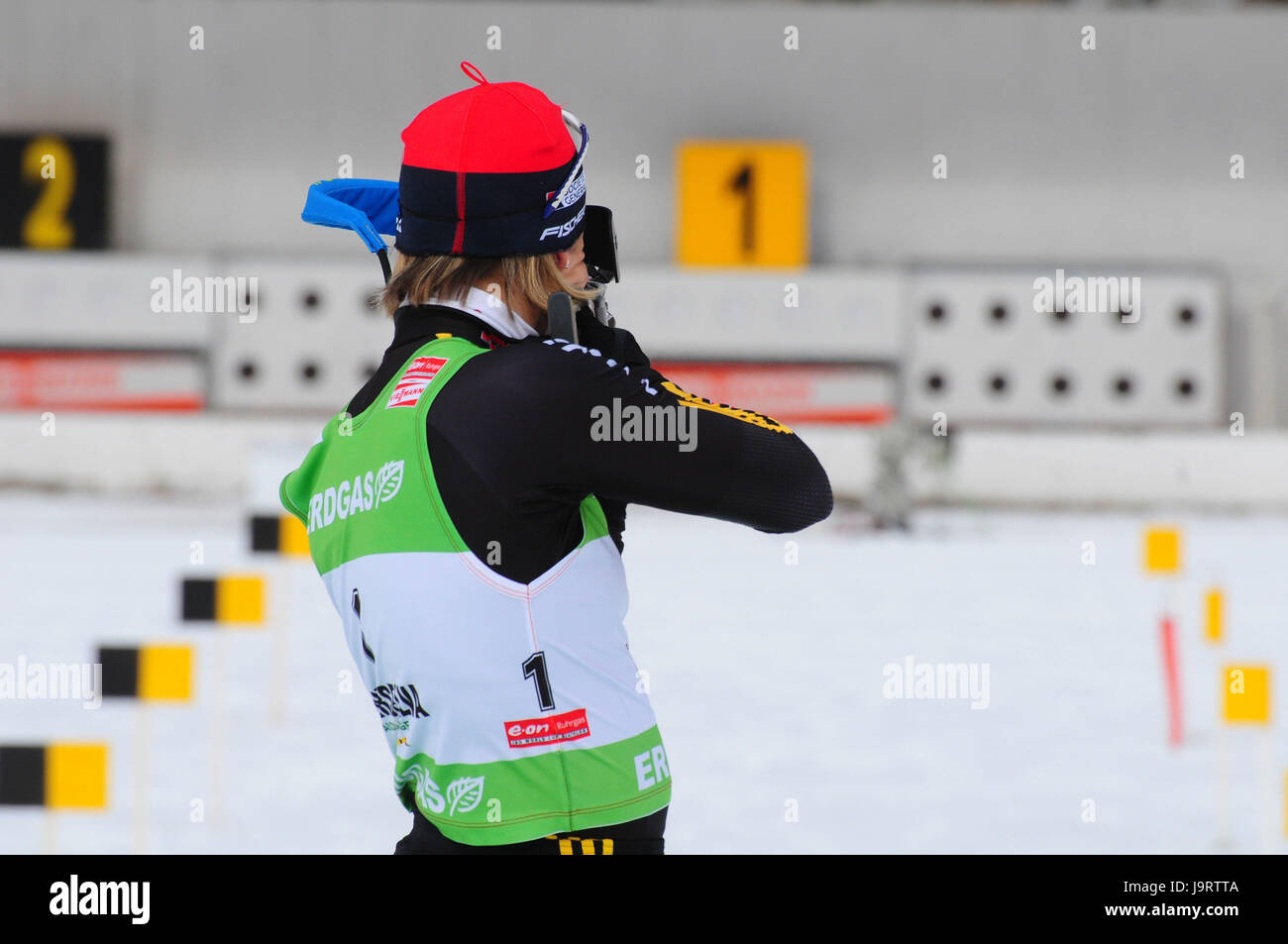 Biathlon athlete shooting back view hi-res stock photography and images ...