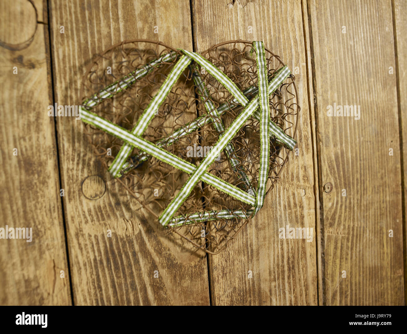 wooden wall,wire heart,square cord Stock Photo - Alamy