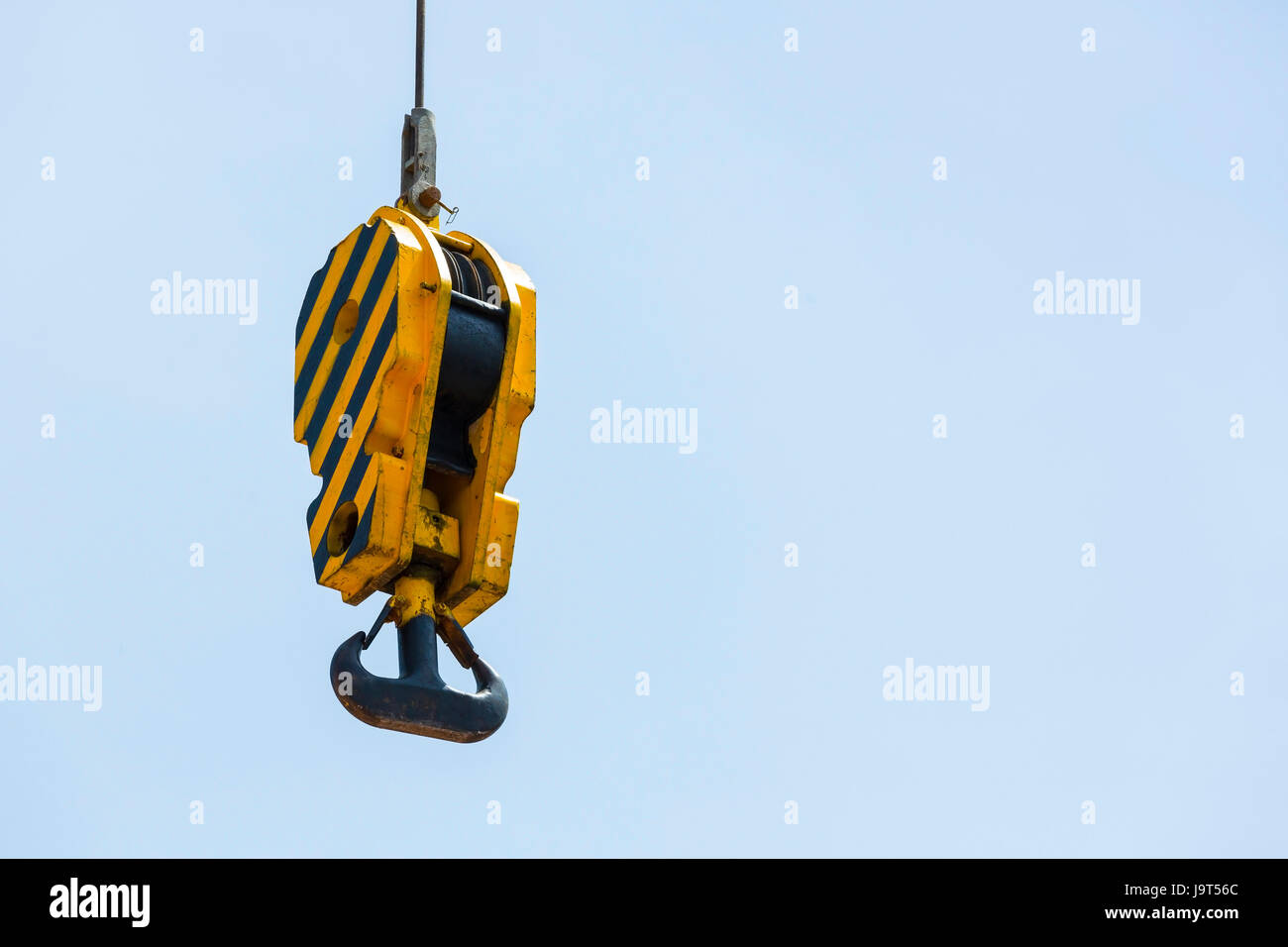 Mechanism of a crane with a hook for lifting loads Stock Photo - Alamy