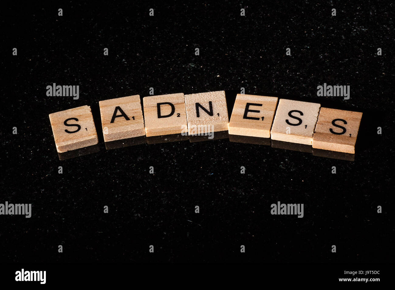 Scrabble Tiles Spelling Sadness Stock Photo - Alamy