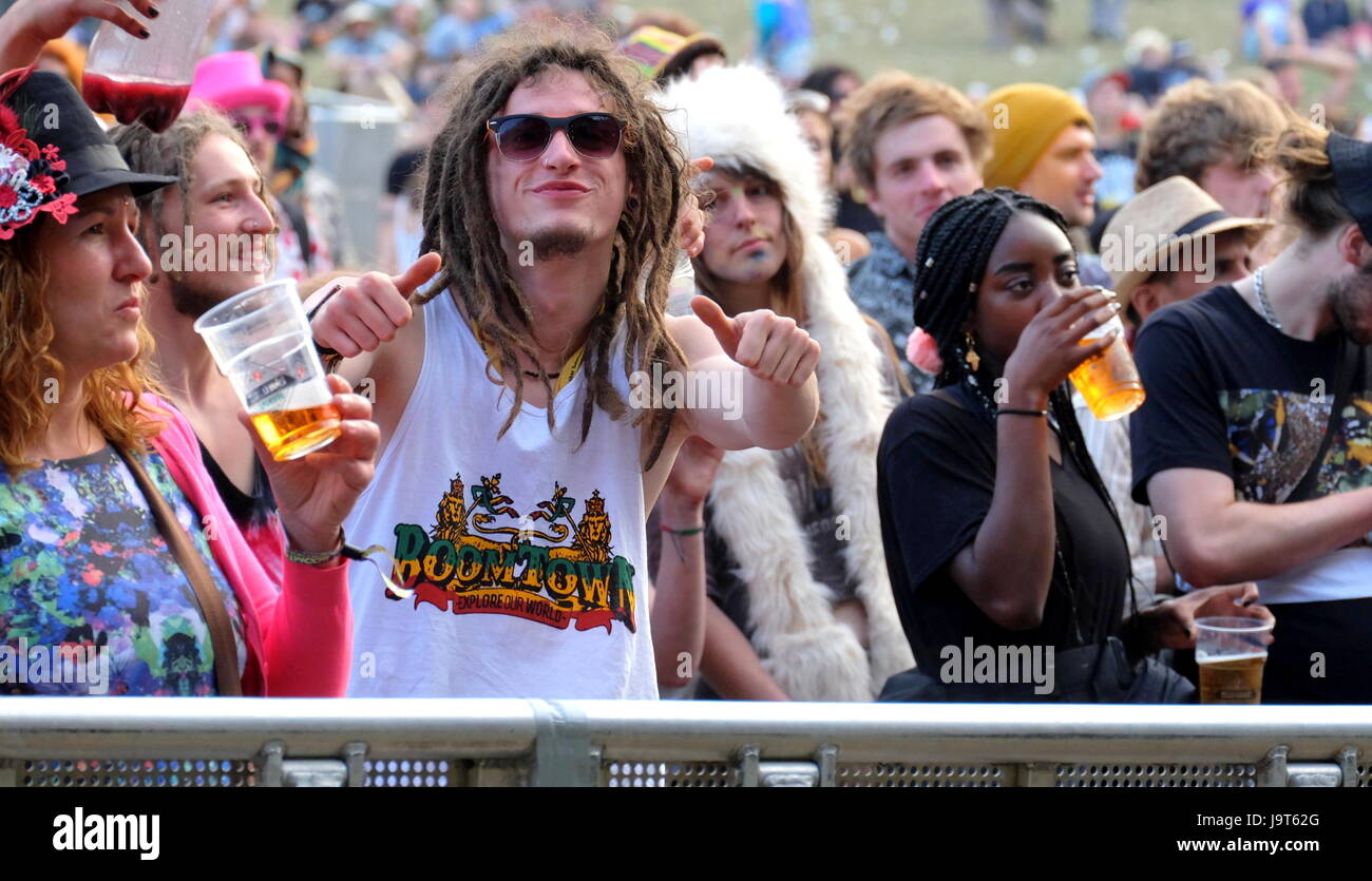Boomtown Fair Festival - August 15 2015: Man with dreadlocks dancing to ...