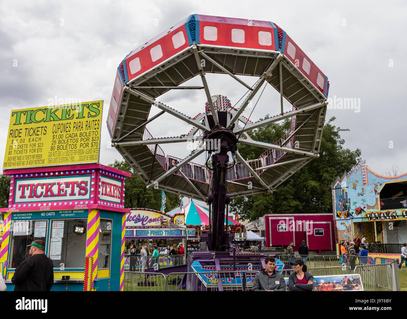 Popular ride with children at the county fair Stock Photo - Alamy